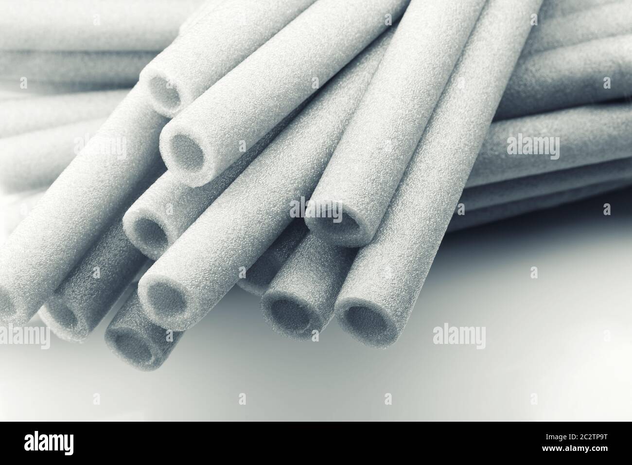 Closeup view of rolls of thermal insulation foam pipe Stock Photo - Alamy