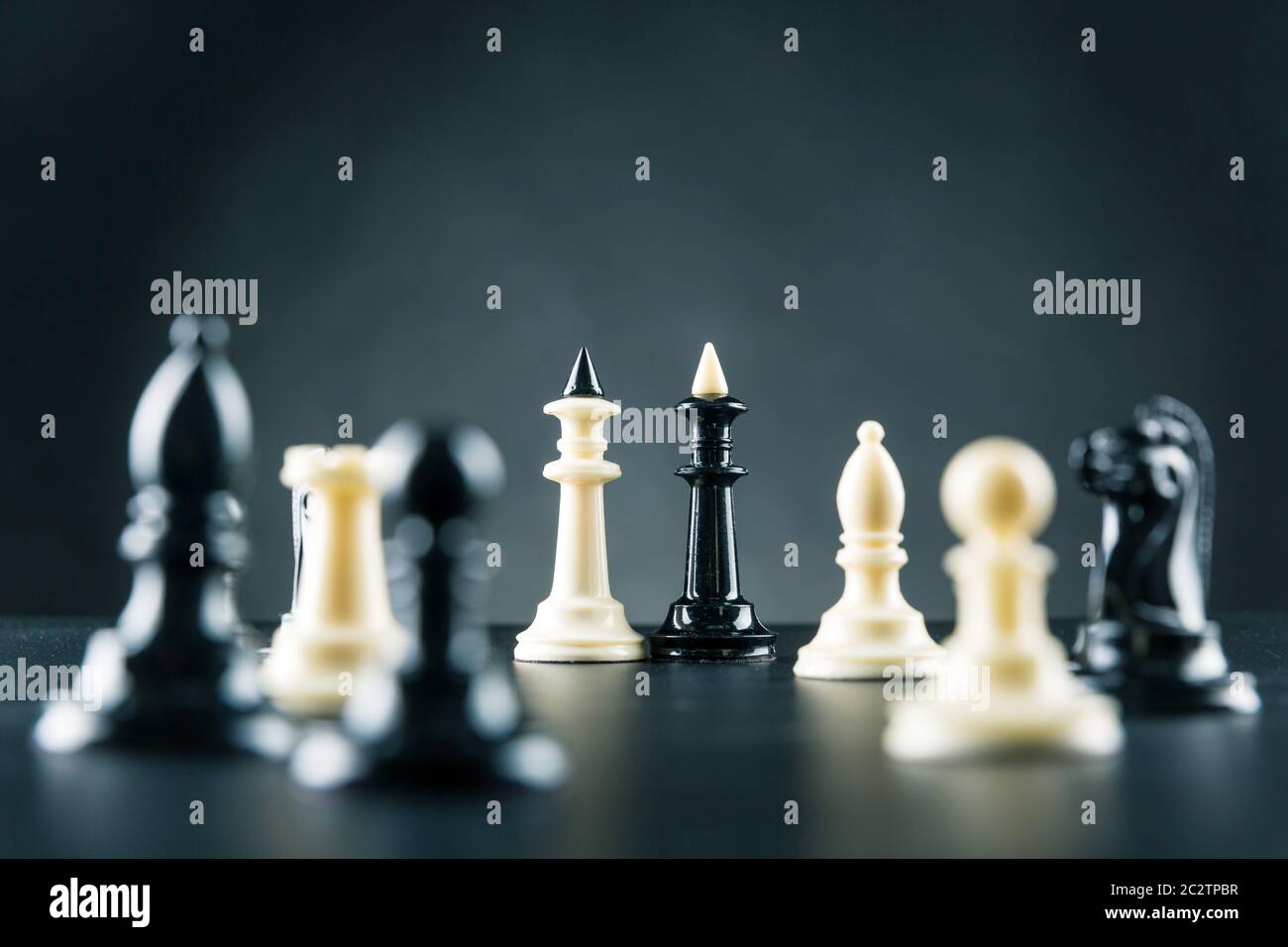 Lots of black and white chess figures on the table Stock Photo - Alamy