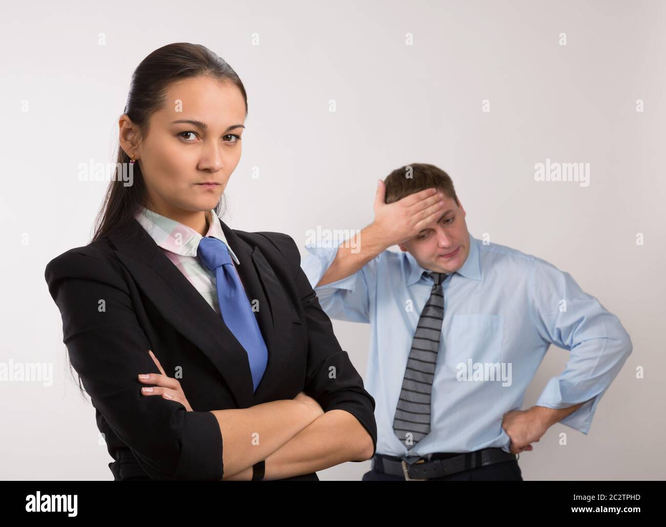 Two young caucasian office worker get mad Stock Photo - Alamy