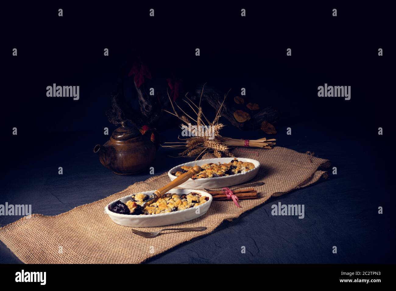Cinnamon prunes with crumble Stock Photo - Alamy