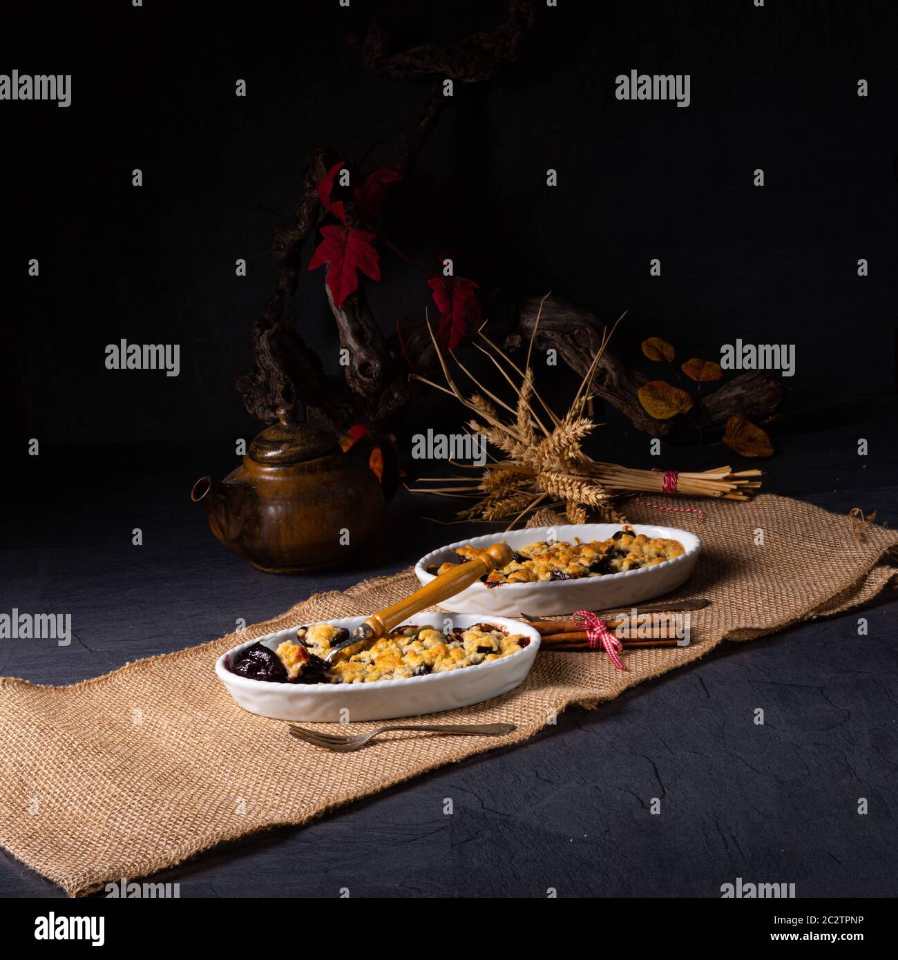 Cinnamon prunes with crumble Stock Photo - Alamy