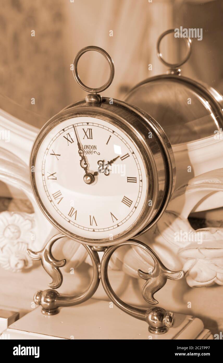 Vintage clock. Sepia Stock Photo - Alamy