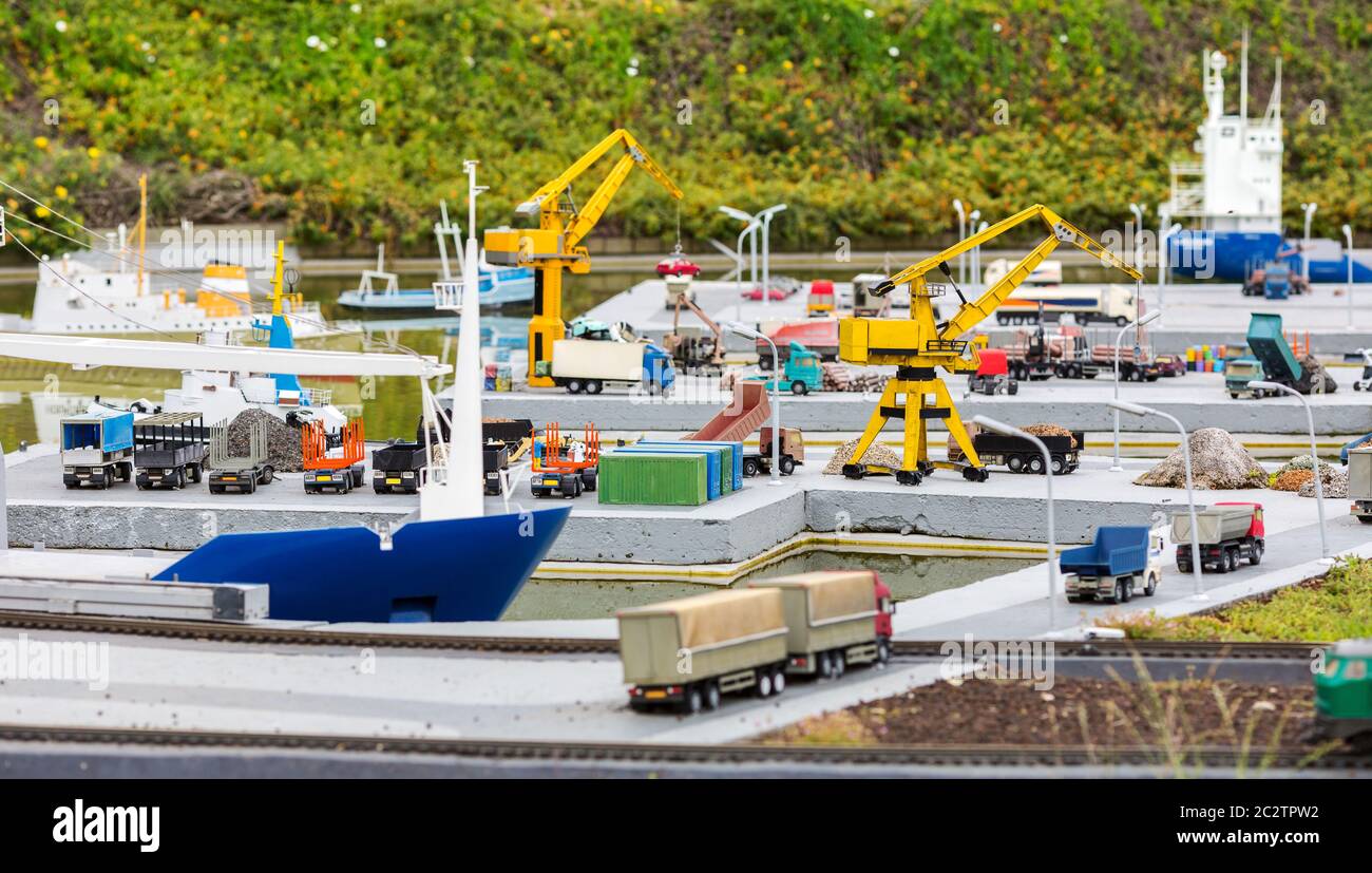 Cargo ships, crane and trucks in port, miniature scene outdoor, europe ...