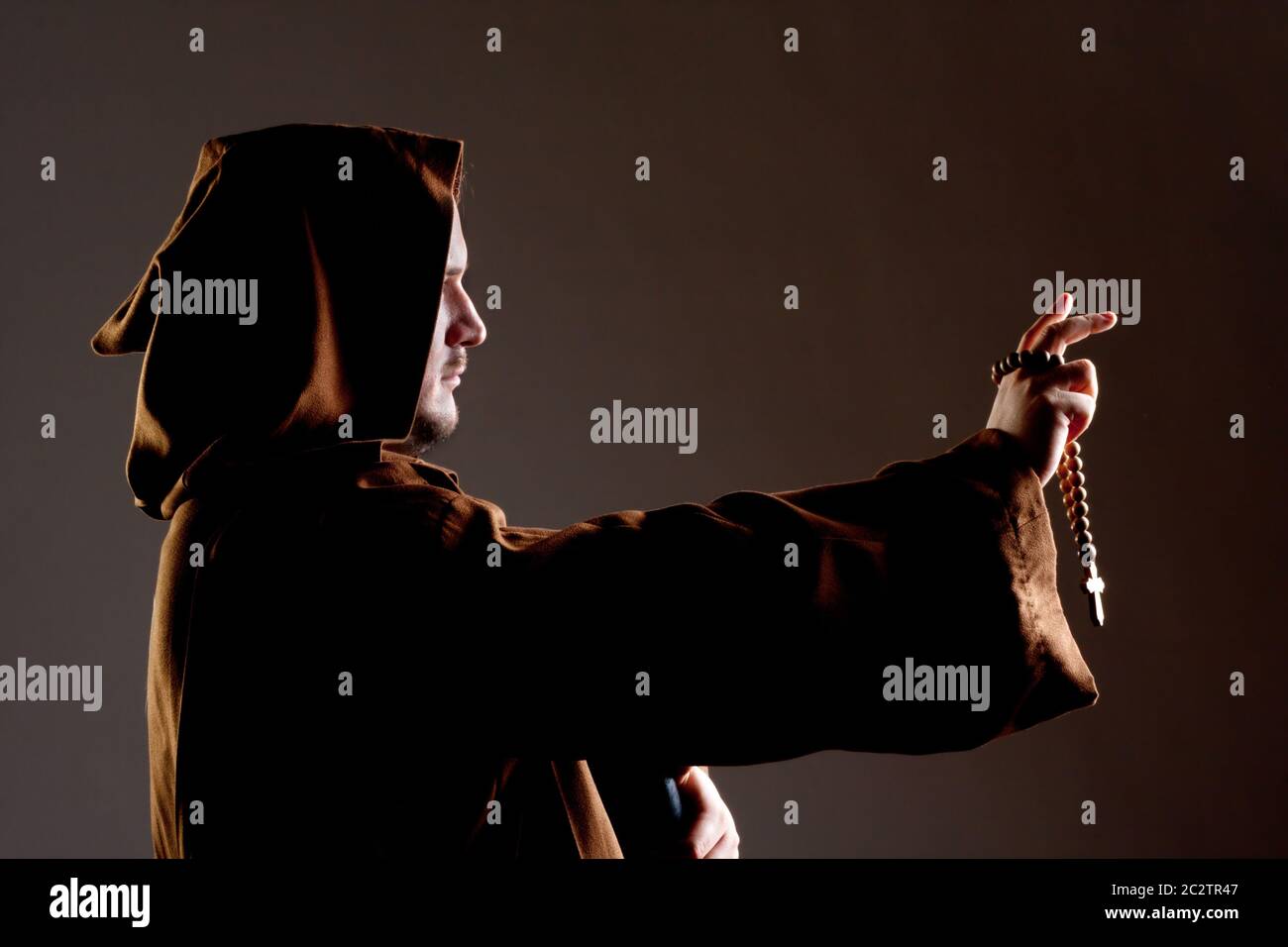 Portrait of preaching medieval monk with wooden rosary Stock Photo - Alamy