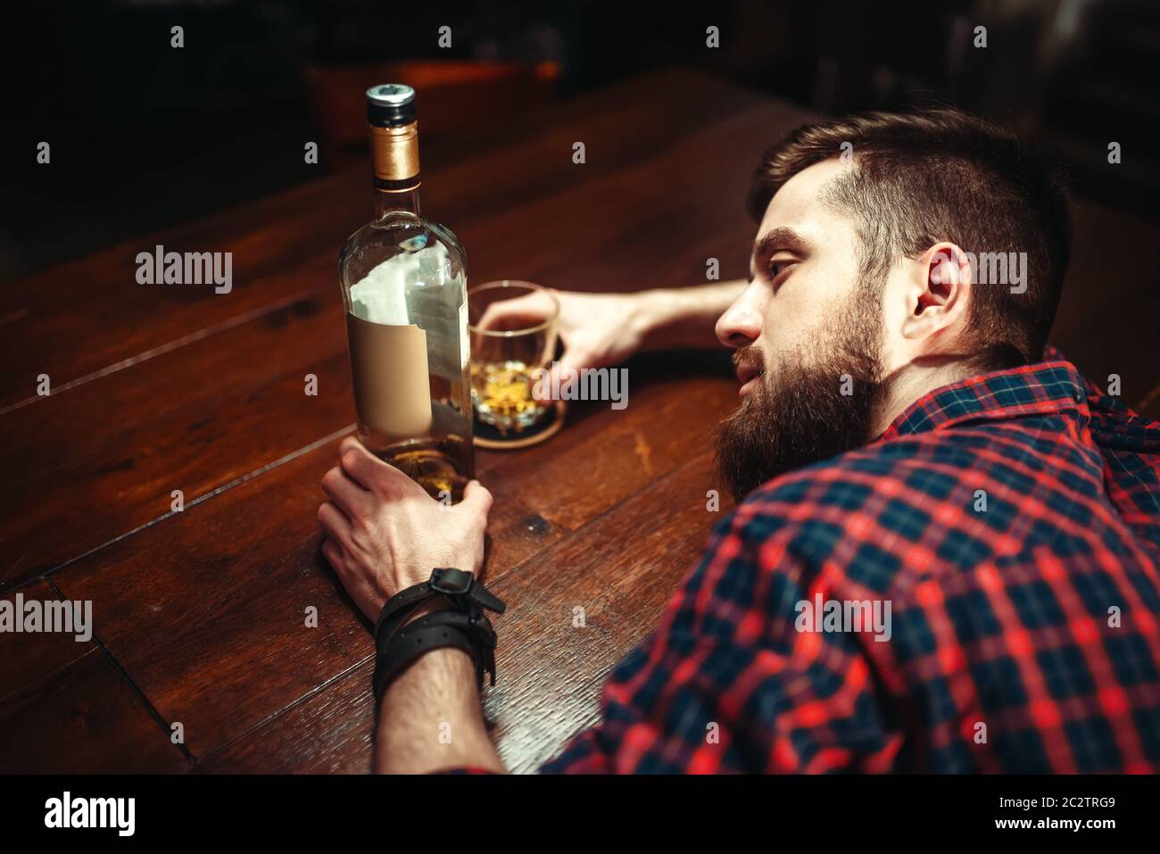 Drunk man sleeps at the bar counter, top view, alcohol addiction. Male ...
