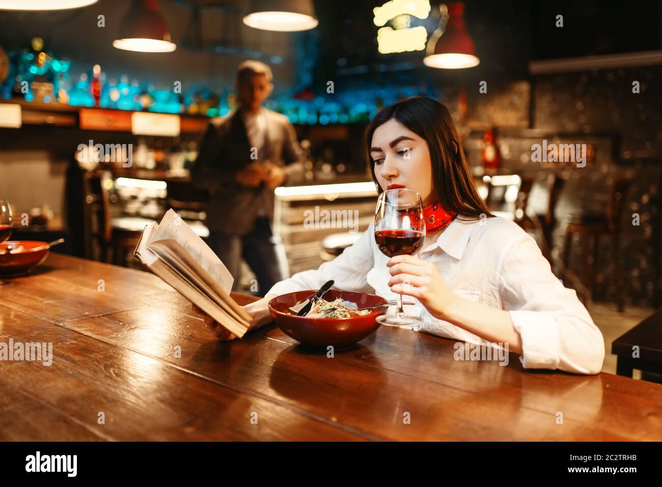 Man wine glass reading book hi-res stock photography and images - Alamy