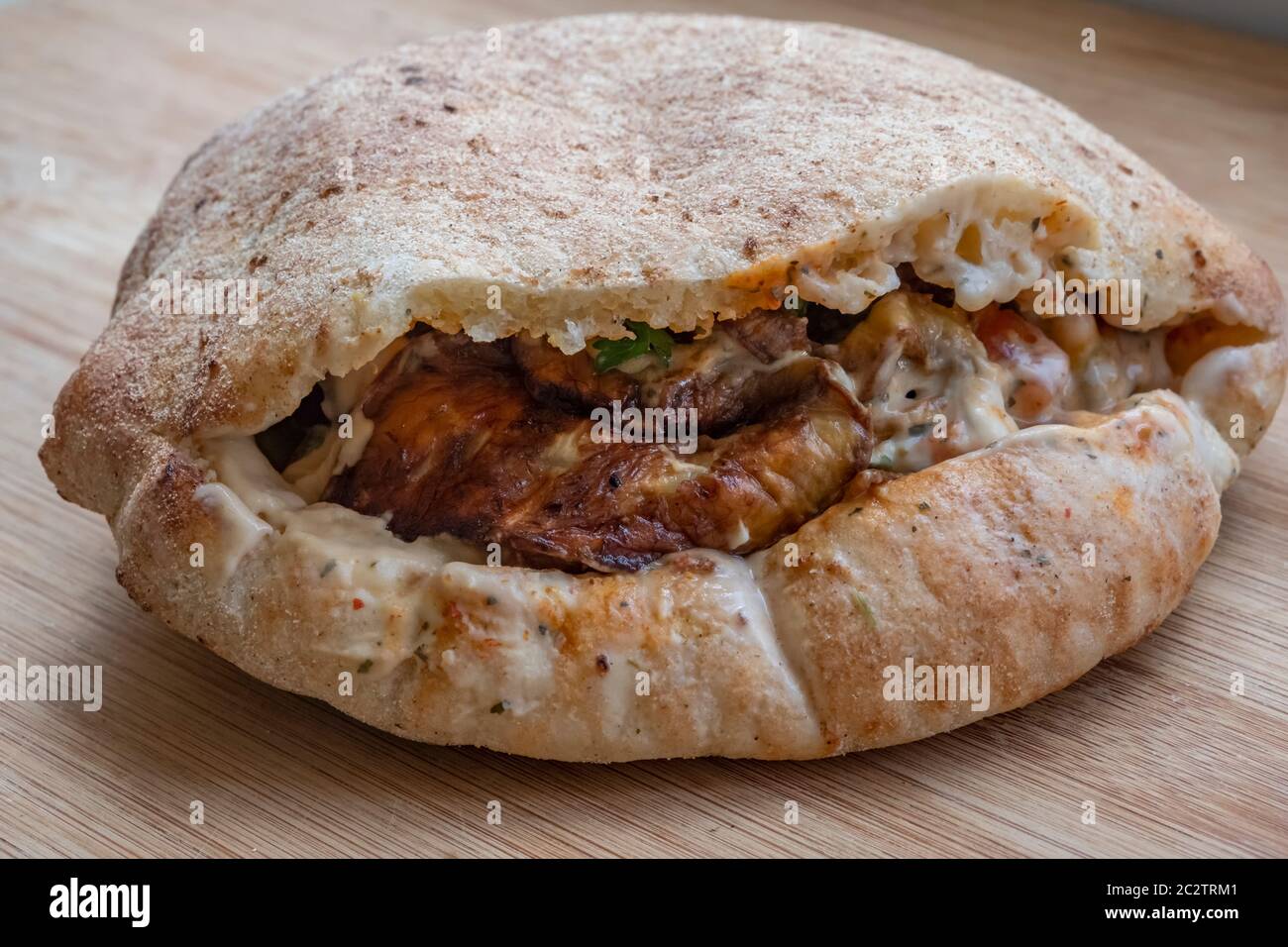 Sabich or sabih sandwich served in pita bread stuffed with fried ...
