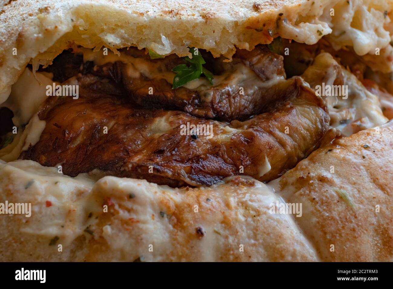 Sabich or sabih sandwich served in pita bread stuffed with fried ...