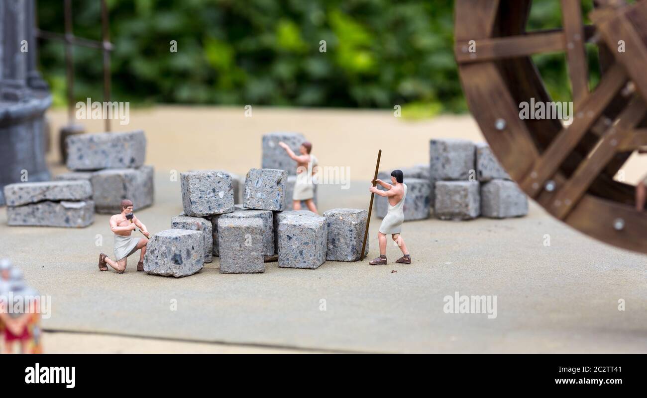 Ancient people works with stone, miniature scene outdoor, europe. Mini ...