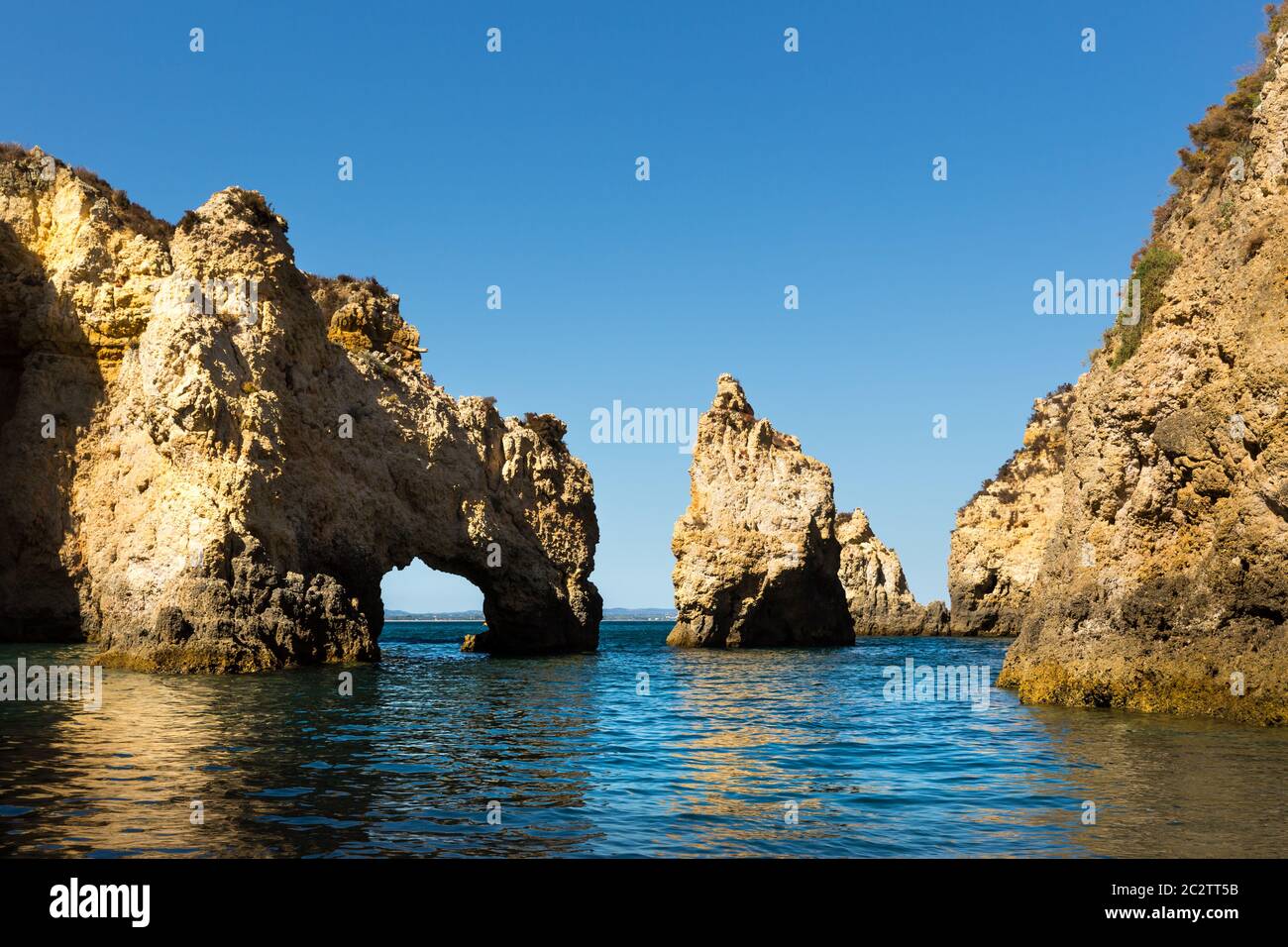 Beautiful rocky cliffs with grotto in the ocean, Portugal Stock Photo ...