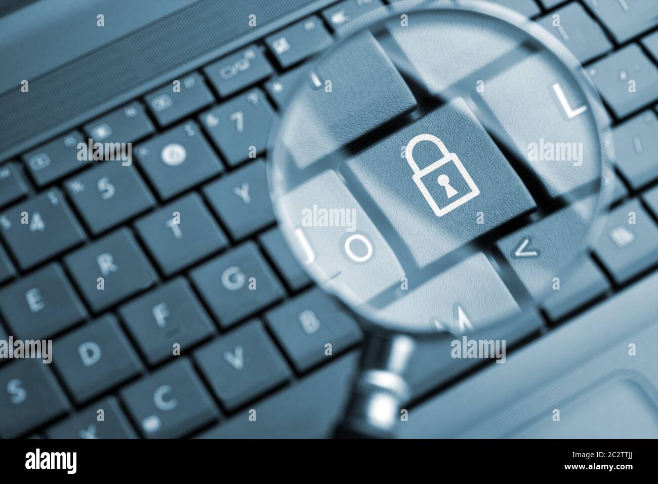 Magnifying glass focused on lock icon Stock Photo - Alamy