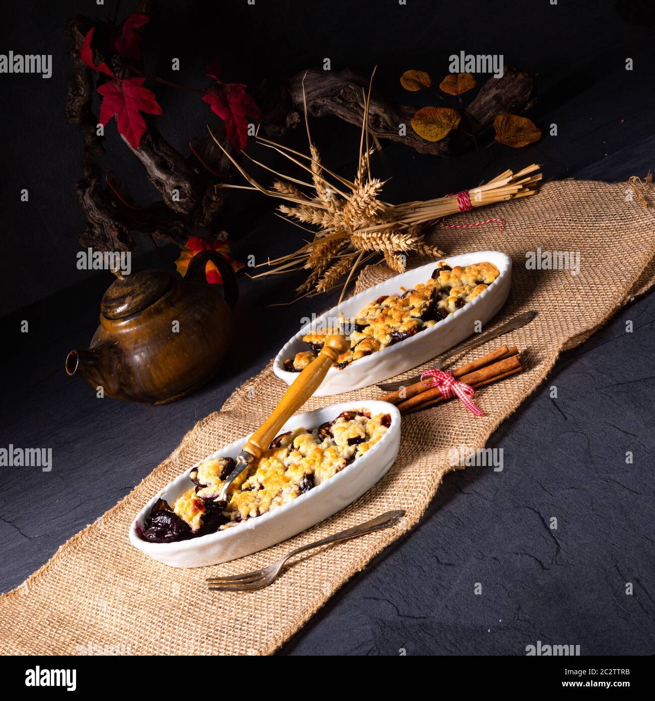 Cinnamon prunes with crumble Stock Photo - Alamy
