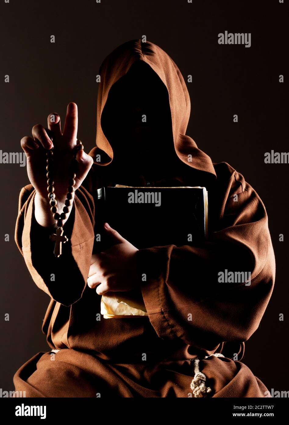 Portrait of mystery preaching monk with wooden rosary and bible Stock ...
