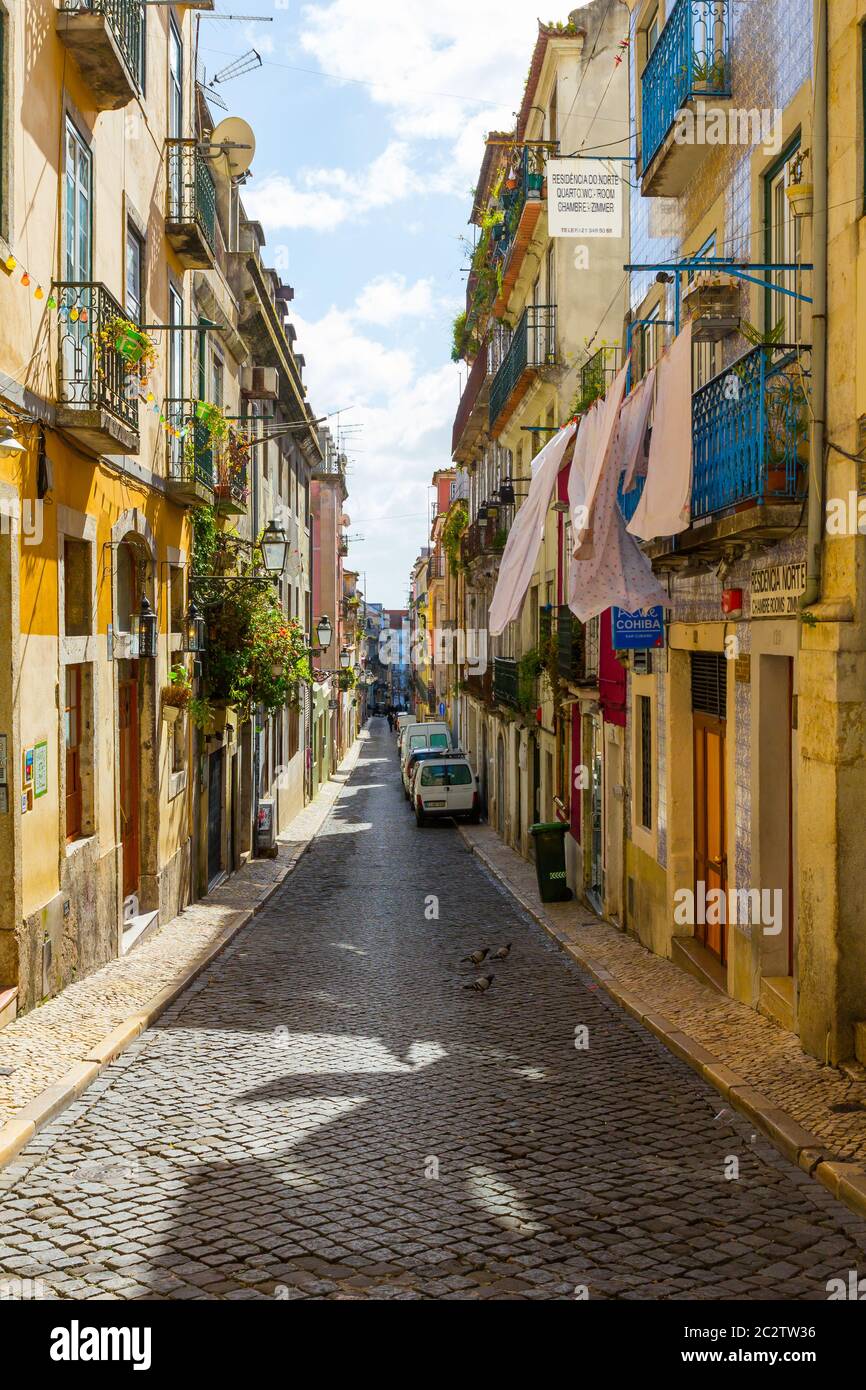 Lisbon, Portugal. Beautiful typical narrow portuguese street on a sunny ...