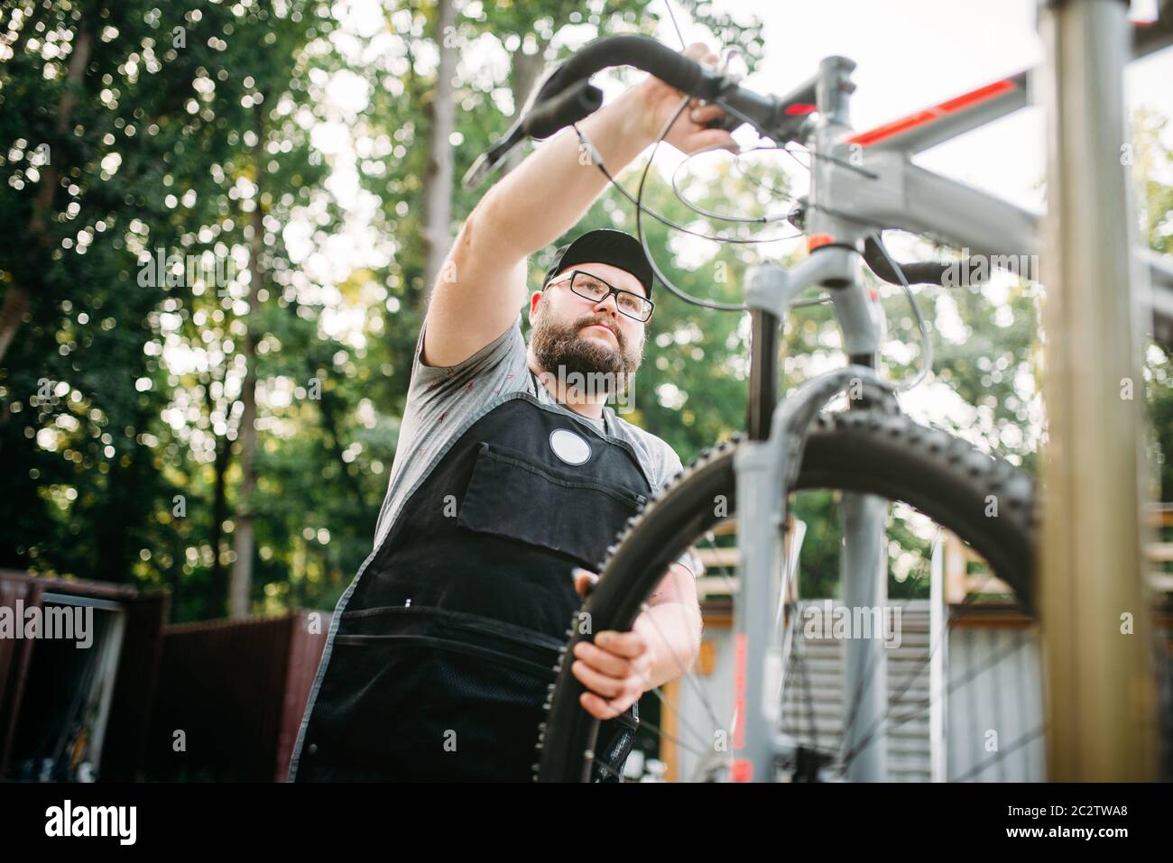 Bicycle mechanic repair bike, top view. Cycle workshop outdoor ...