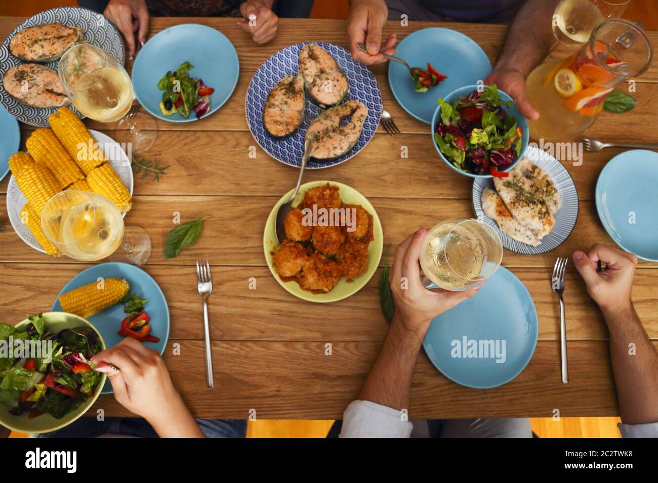 Hands of a group of people cheering with white wine Stock Photo - Alamy