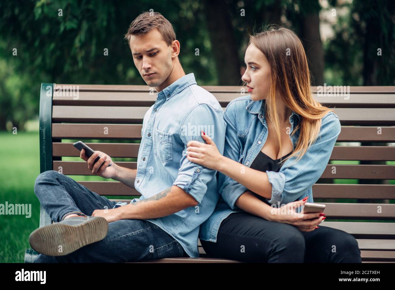 Phone addicted people, man using smartphone and ignoring his woman ...