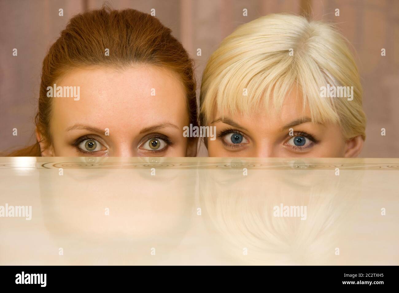 Two surprised woman Stock Photo - Alamy