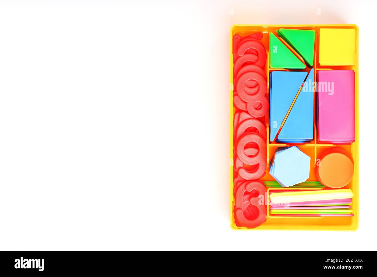 Colorful figures and numbers for children in a box. A tool for ...