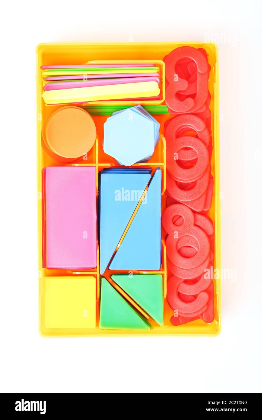 Colorful figures and numbers for children in a box. A tool for ...