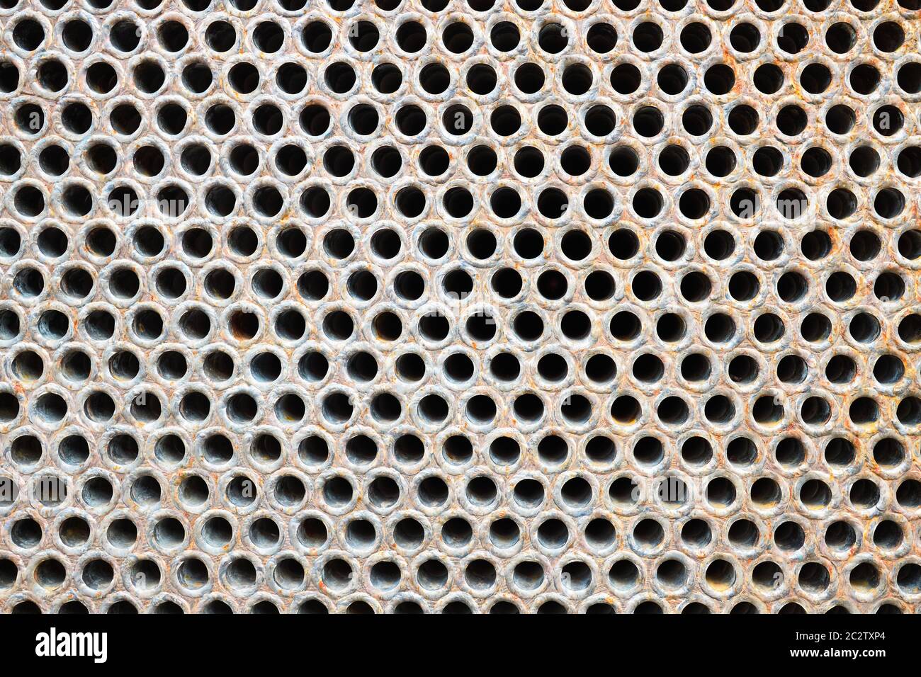 Tube sheet or plate of heat exchanger or boiler closeup texture vibrant ...