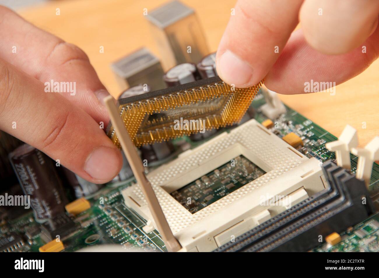 Installing computer processor to motherboard Stock Photo - Alamy