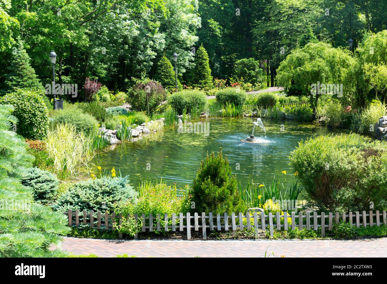 Beautiful lake in the green spring park Stock Photo - Alamy