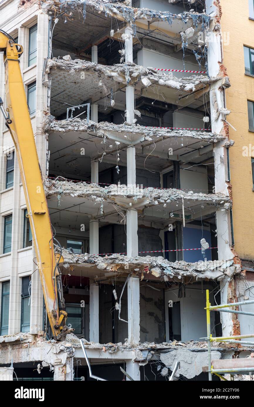 Construction site, house demolition in old european city. Crane works ...