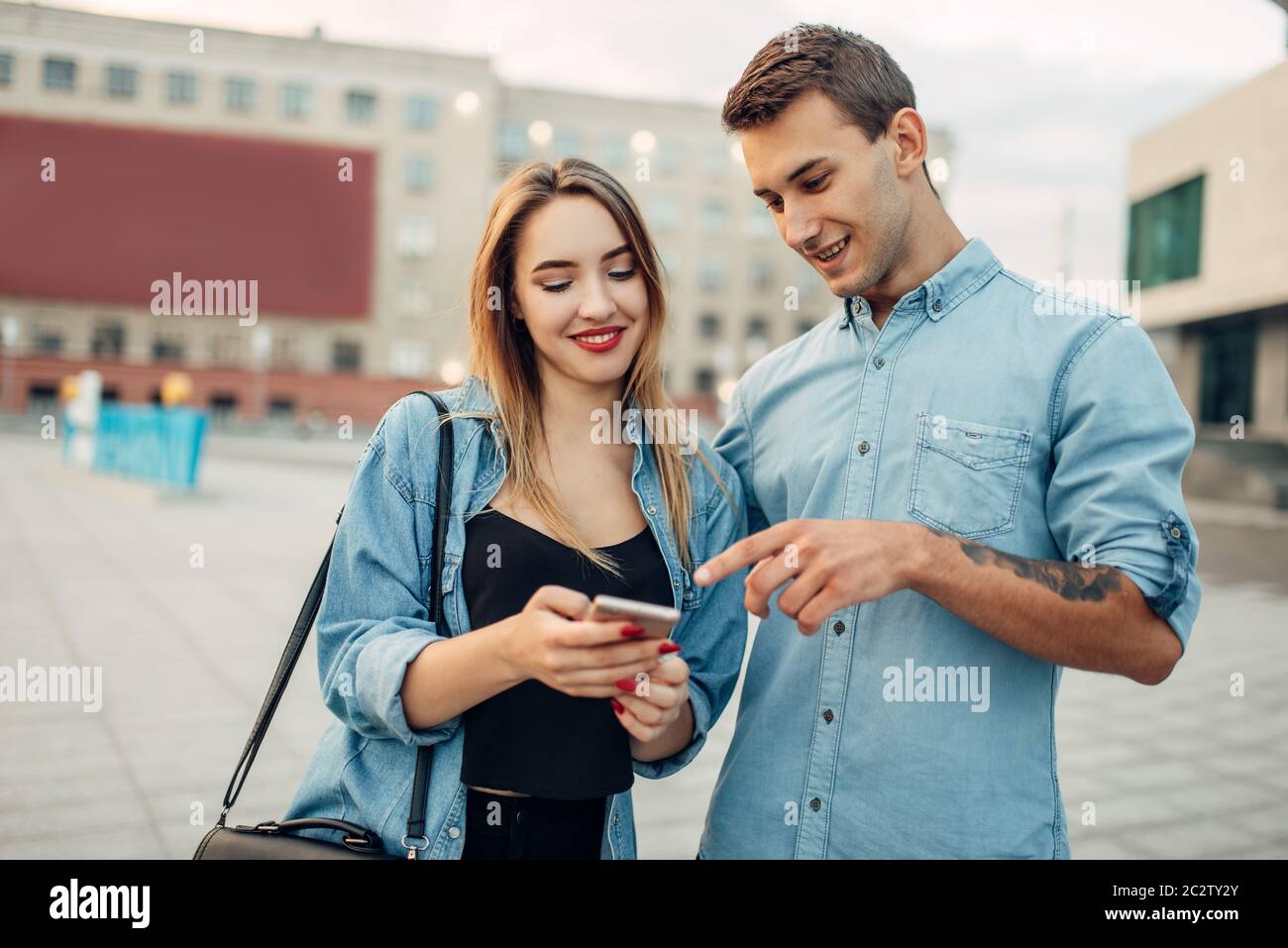 Phone addiction, addict woman shows her social page to young man ...