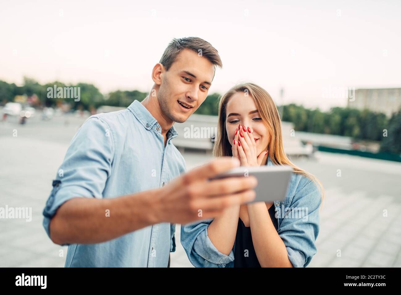Phone addiction, couple looking on smartphone screen, social addicted ...