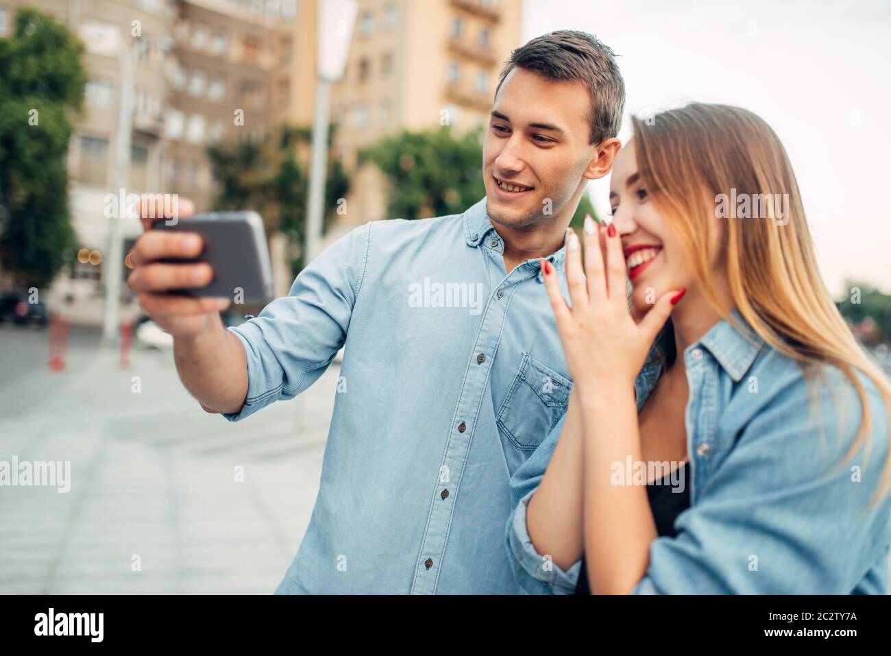 Phone addiction, couple looking on smartphone screen, social addicted ...