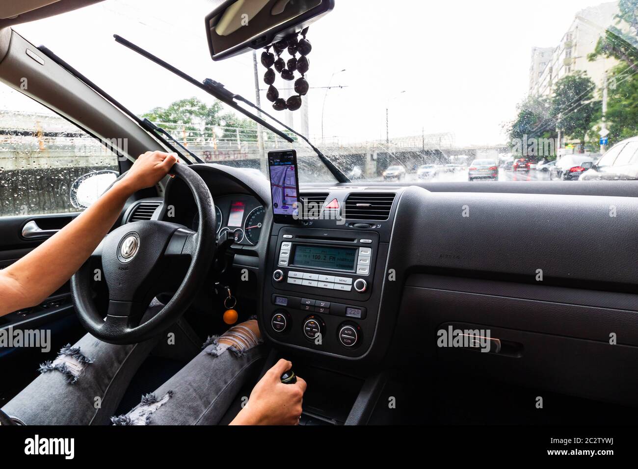 Using waze maps application on smartphone on car dashboard, Driver ...