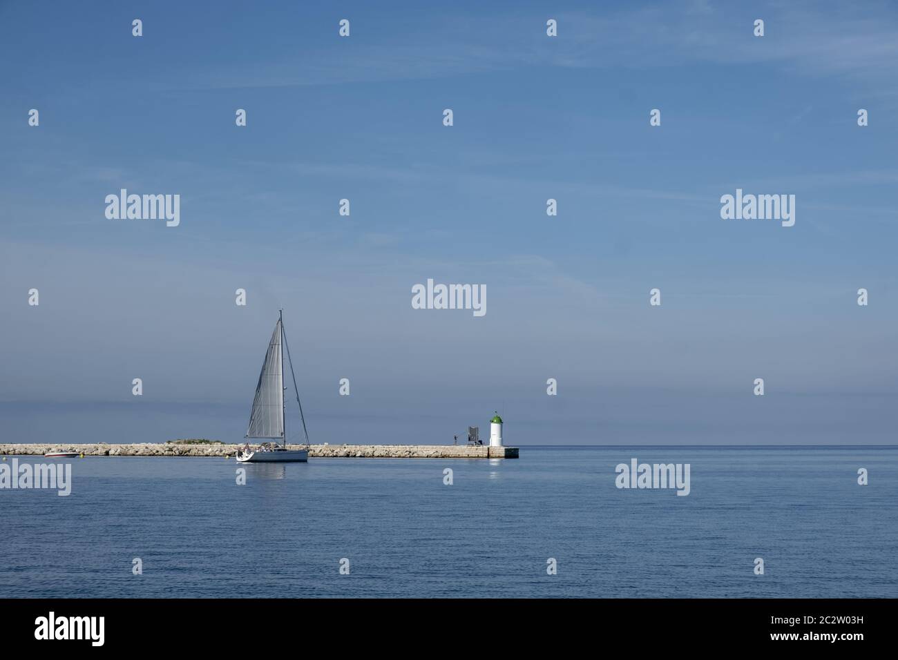 Sailboat by lighthouse hi-res stock photography and images - Alamy