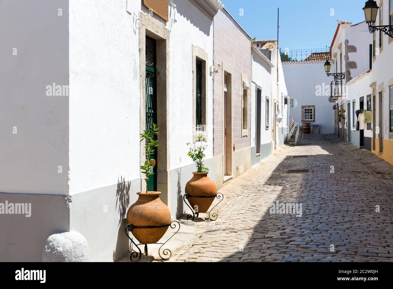 Narrow european street in a sunny day hi-res stock photography and ...