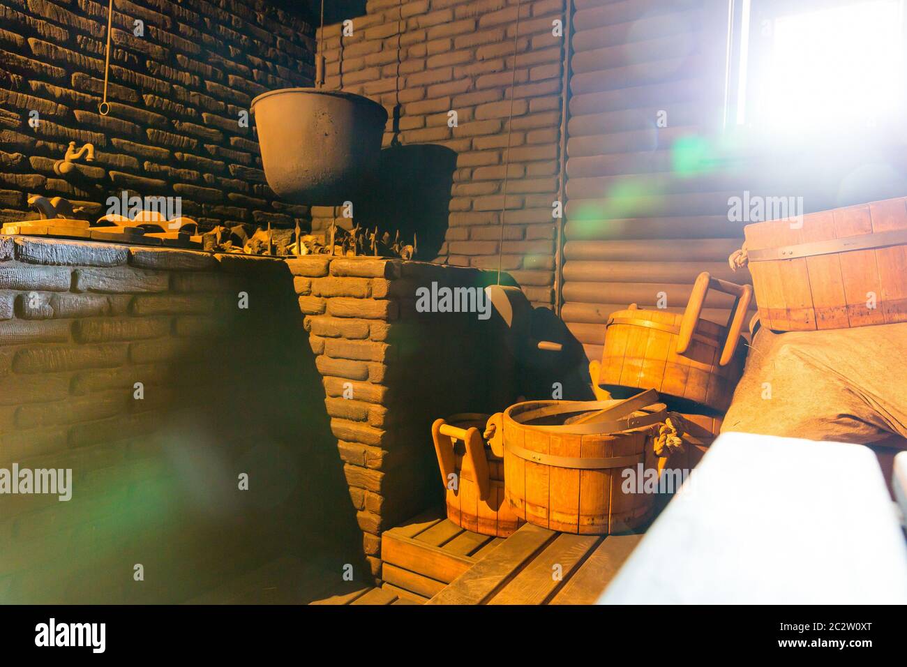 Cauldron for boiling water in the old bath-house room Stock Photo - Alamy