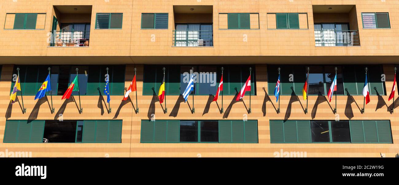 Building with flags of different countries close up Stock Photo - Alamy