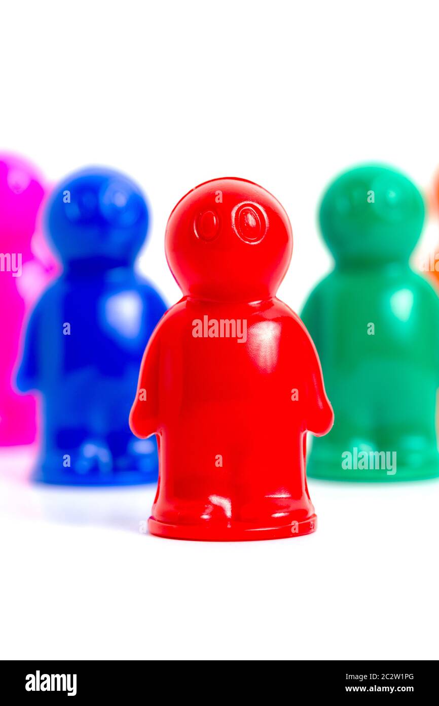 Colorful toy people group vertical image Stock Photo - Alamy