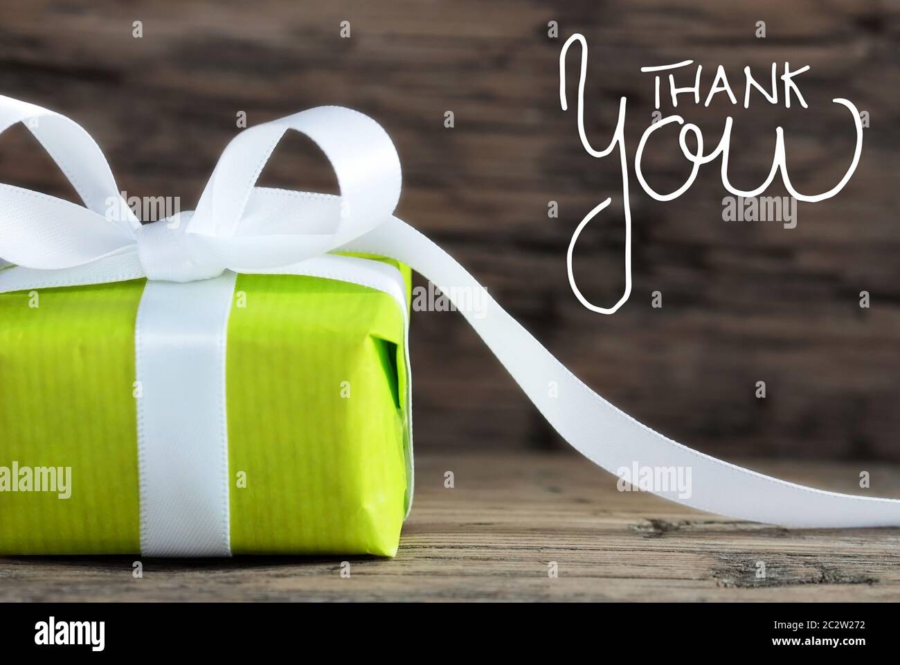 Label With English Calligraphy Thank You. One Green Gift With White Bow ...