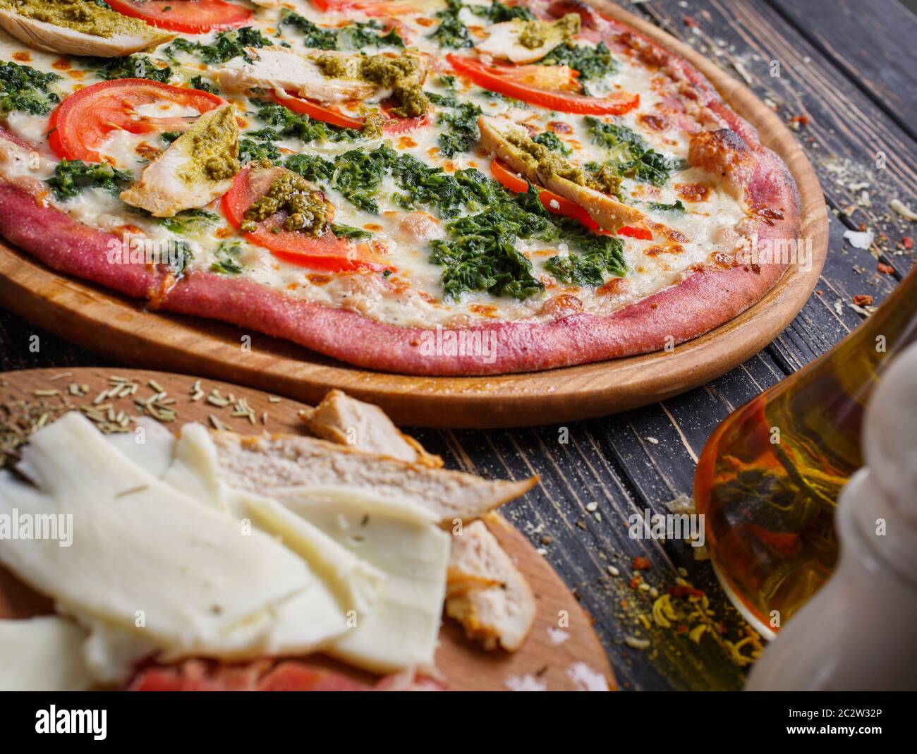Traditional Italian pizza on a dark table with ingredients. Pizza menu ...