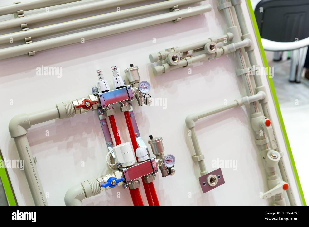 Water pvc pipeline valves and gauge on the stand in plumbing store ...