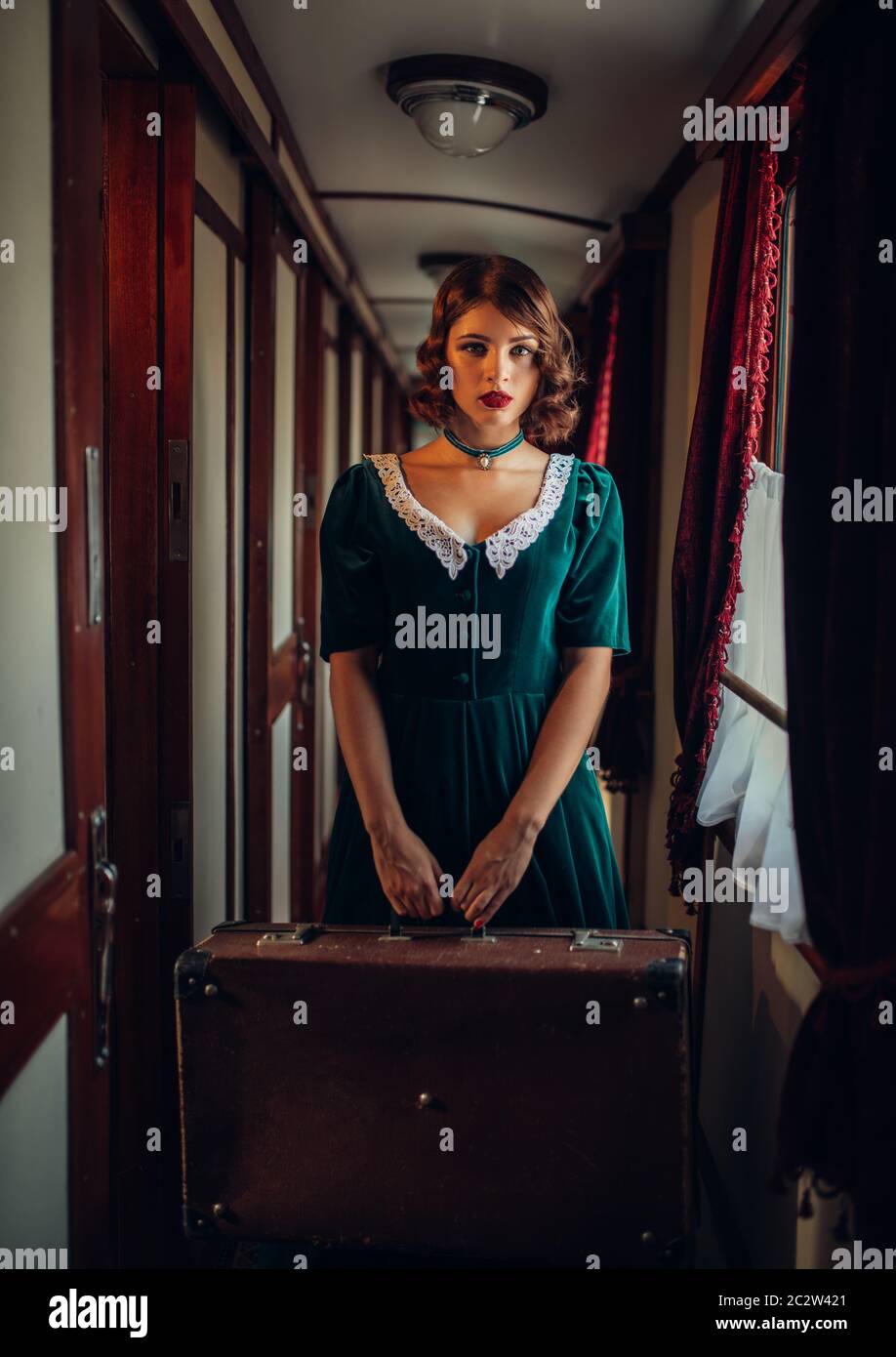 Woman suitcase in retro train hi-res stock photography and images - Alamy