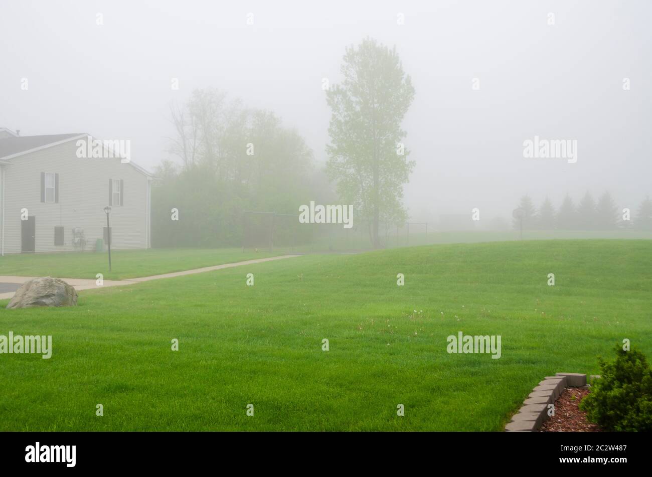 Landscape shrouded in early morning mist. Spring season in Michigan ...
