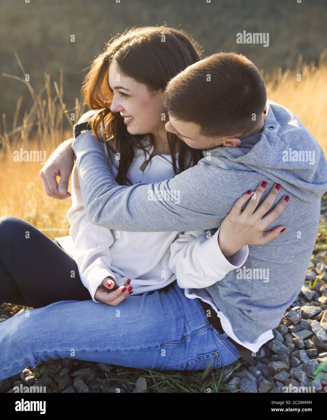 Romantic couple dressed in cozy sweaters together Stock Photo - Alamy