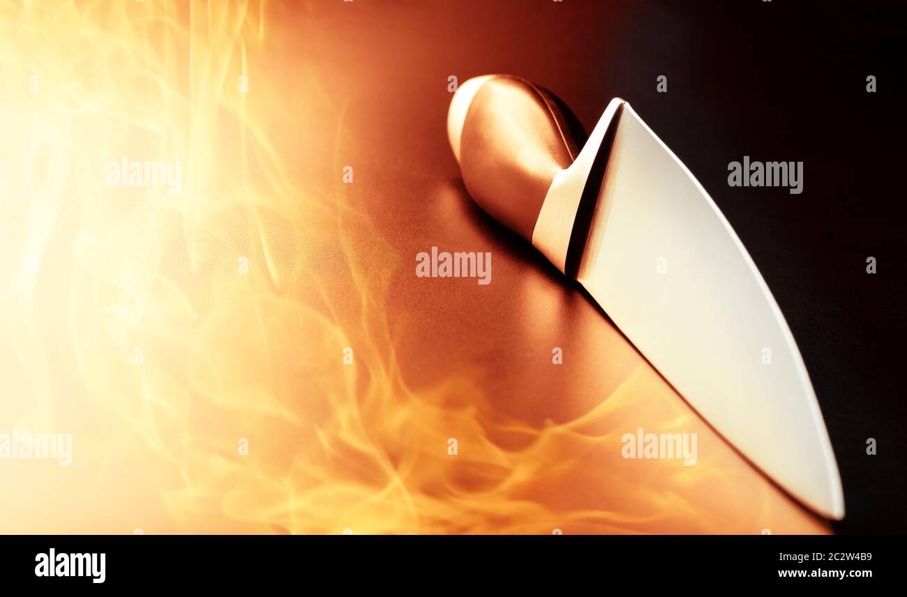 Closeup of professional knife on kitchen fire Stock Photo - Alamy