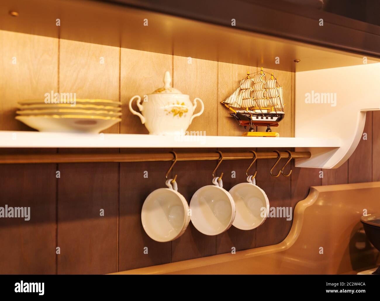 Closeup photo of white plates and dinnerware in a cupboard Stock Photo ...