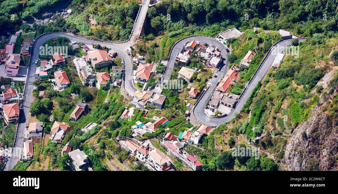 Up view of little city with sprint road in the mountains Stock Photo ...
