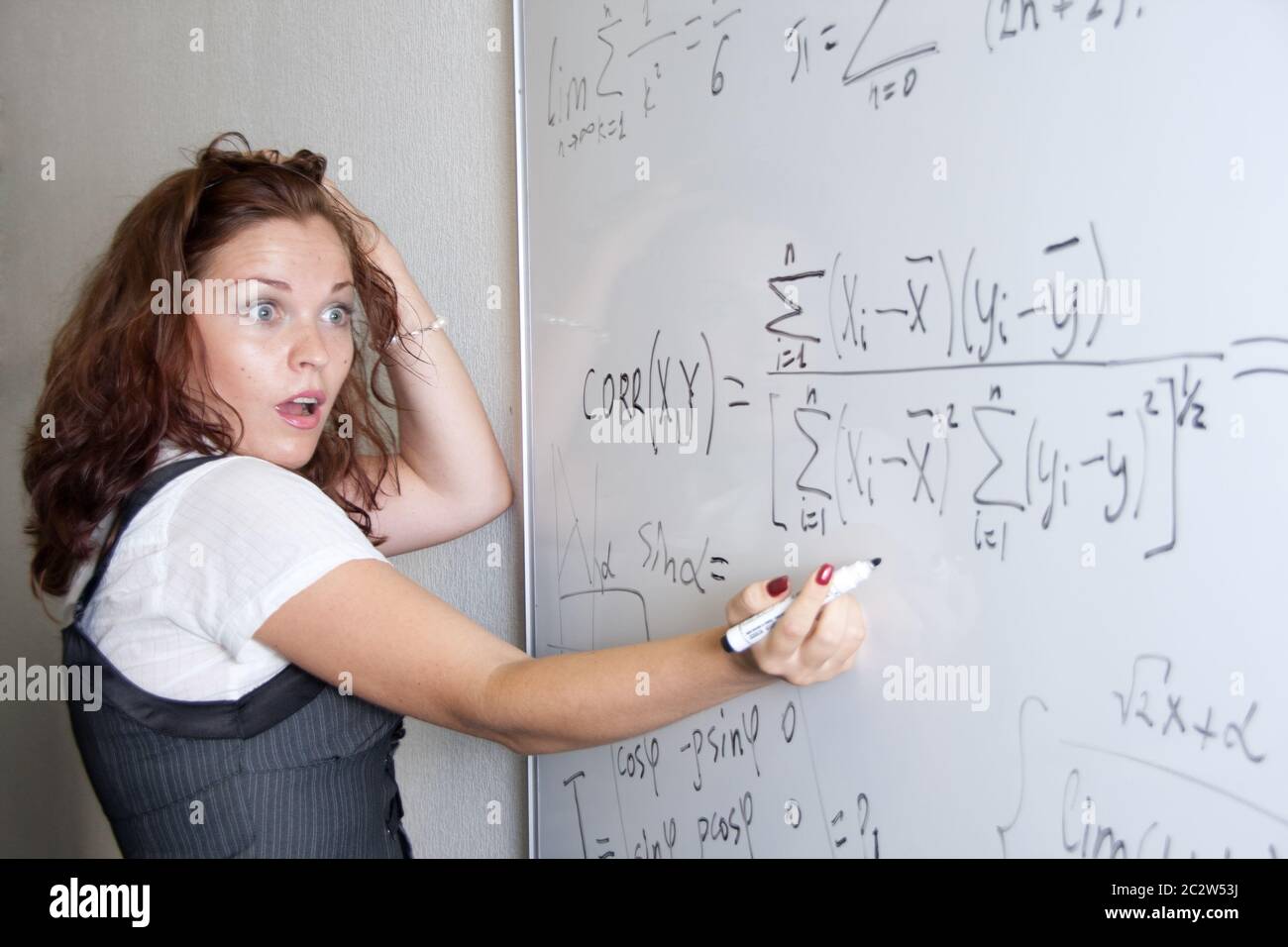 Shocked student. Crazy mathematical formulas Stock Photo - Alamy
