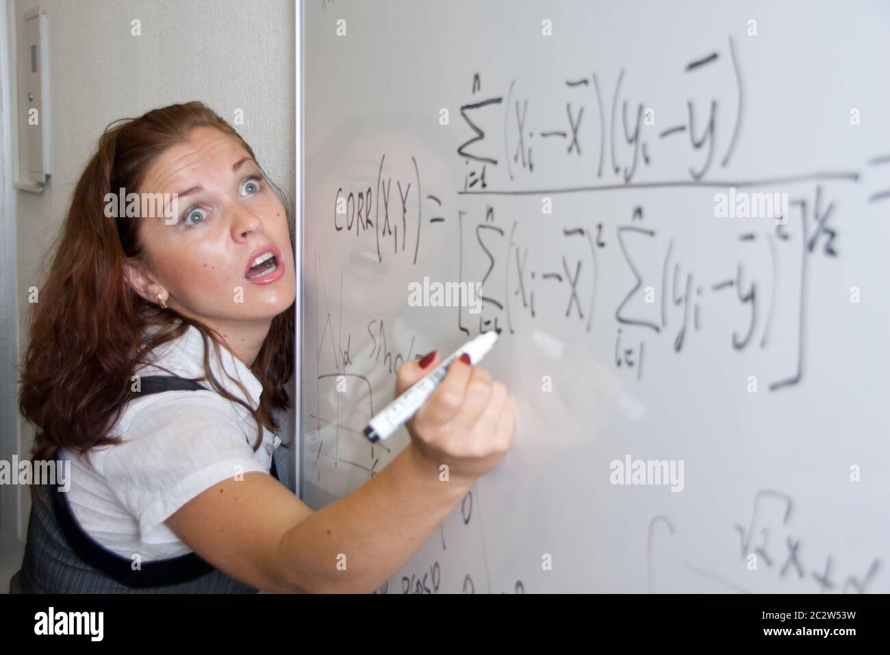 Shocked student. Crazy mathematical formulas Stock Photo - Alamy
