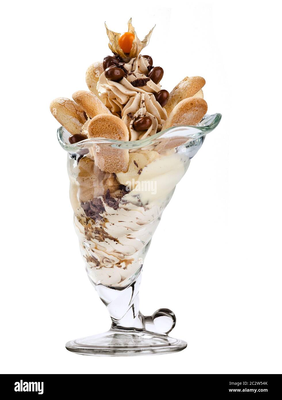 Big ice cream dessert with fruit and whipped cream on a white ...