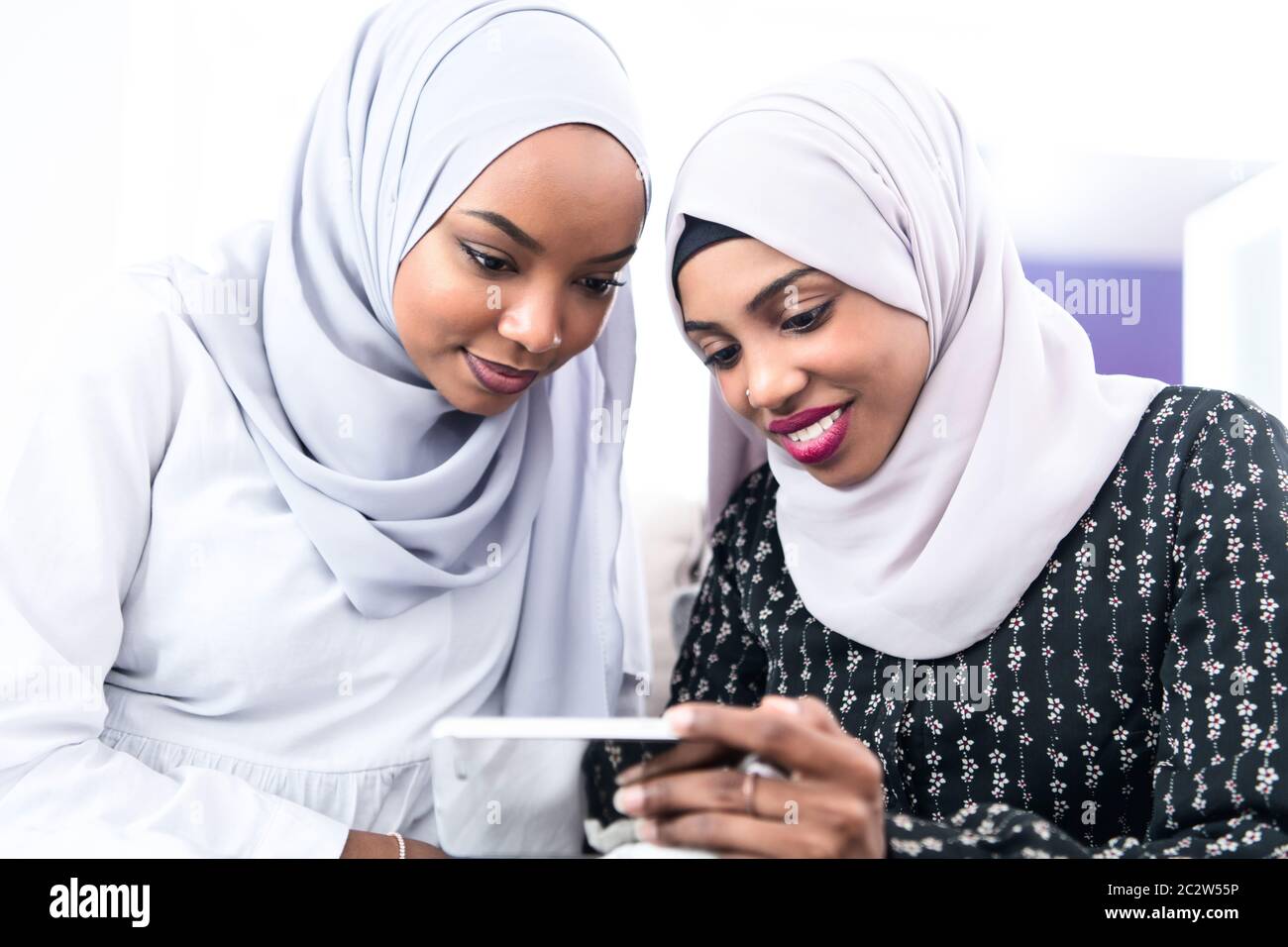african women using smartphone at home Stock Photo - Alamy